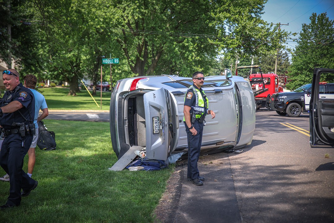 SUV flips on side following 2-car crash on Broad Street in front of ...