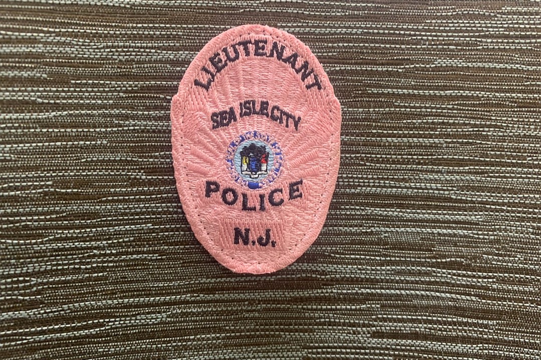 Police Officers Wear Pink Badges to Support Breast Cancer Awareness ...